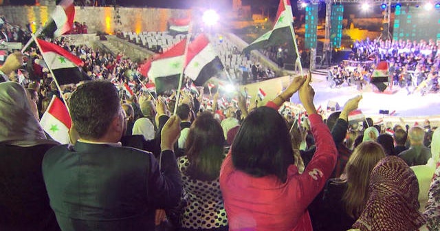 Amid raging war, Syria defiantly celebrates its independence day - CBS News