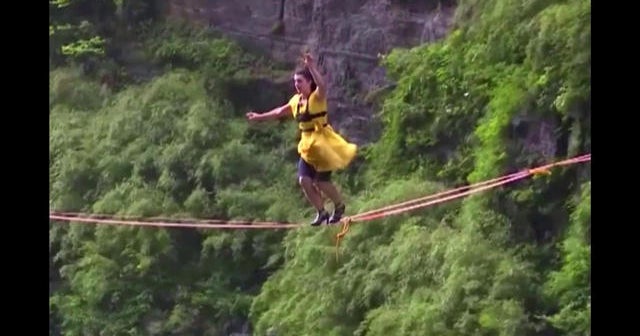Women walk tightrope more than 4,000 feet above ground in high heels ...