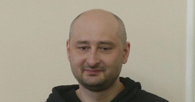 The story behind why a Russian journalist faked his death - CBS News