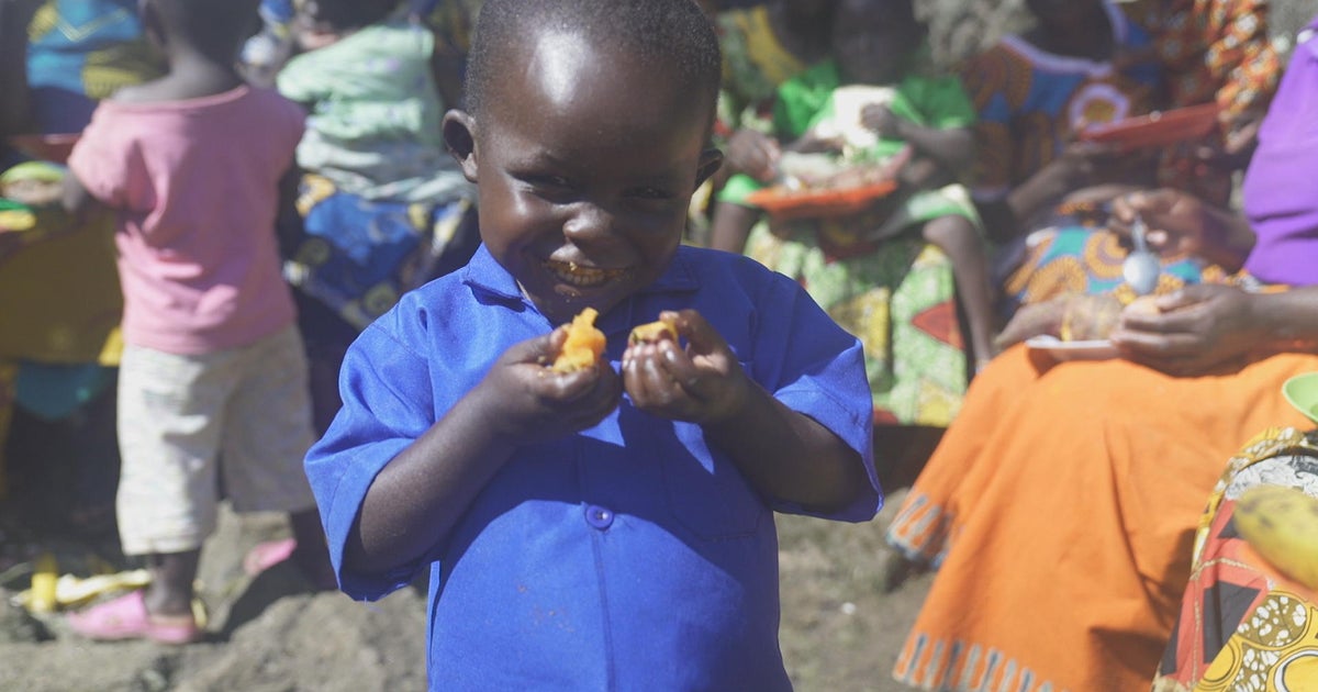 Fighting malnutrition in Rwanda with orange sweet potatoes - CBS News