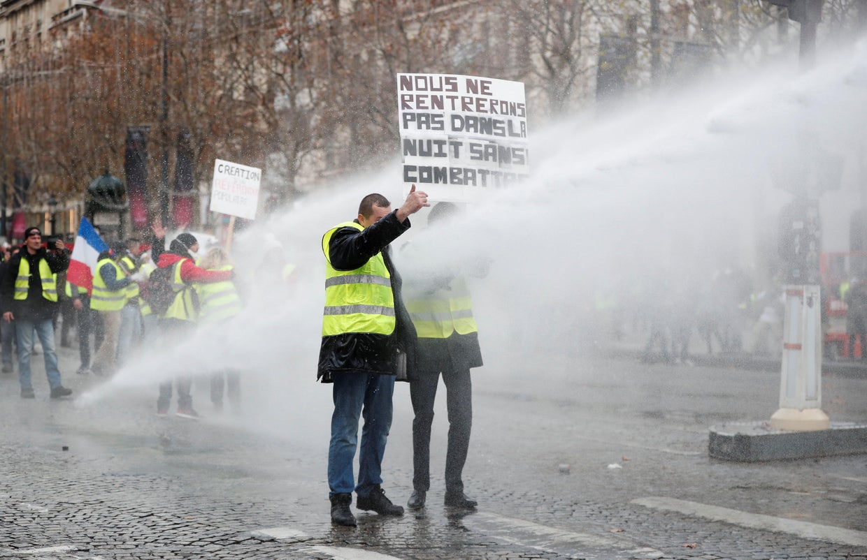 Paris riots: Police fire tear gas and water cannons to disperse ...