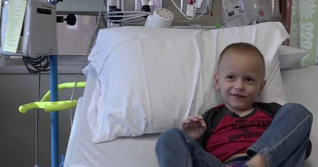 Boy battling rare cancer finishes chemo on 6th birthday, meets favorite heroes - CBS News