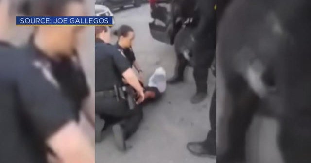 Video shows police putting "spit mask" on 12-year-old boy - CBS News