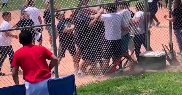 Video shows adults brawling at kids' baseball game - CBS News