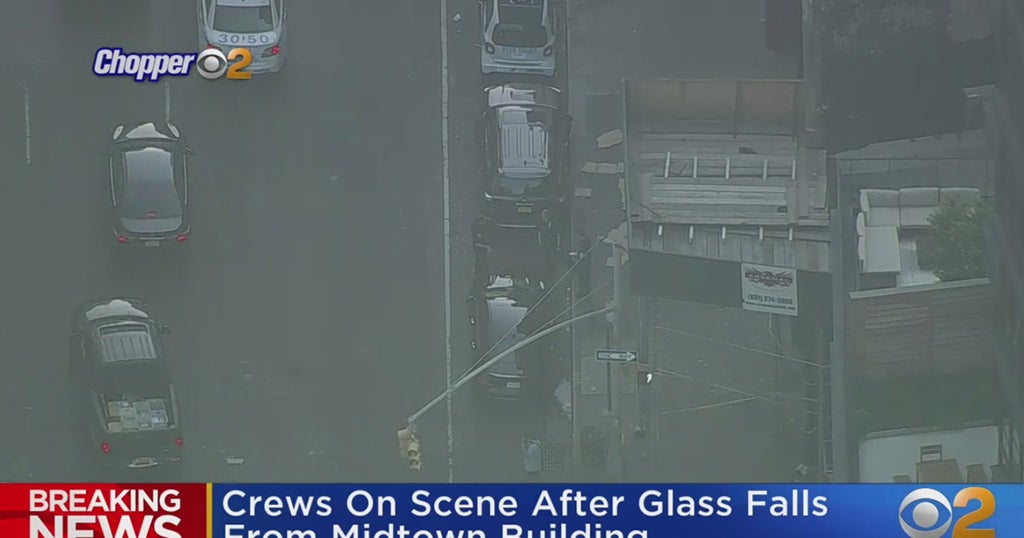 Glass Rains Down From Building In Midtown - CBS New York