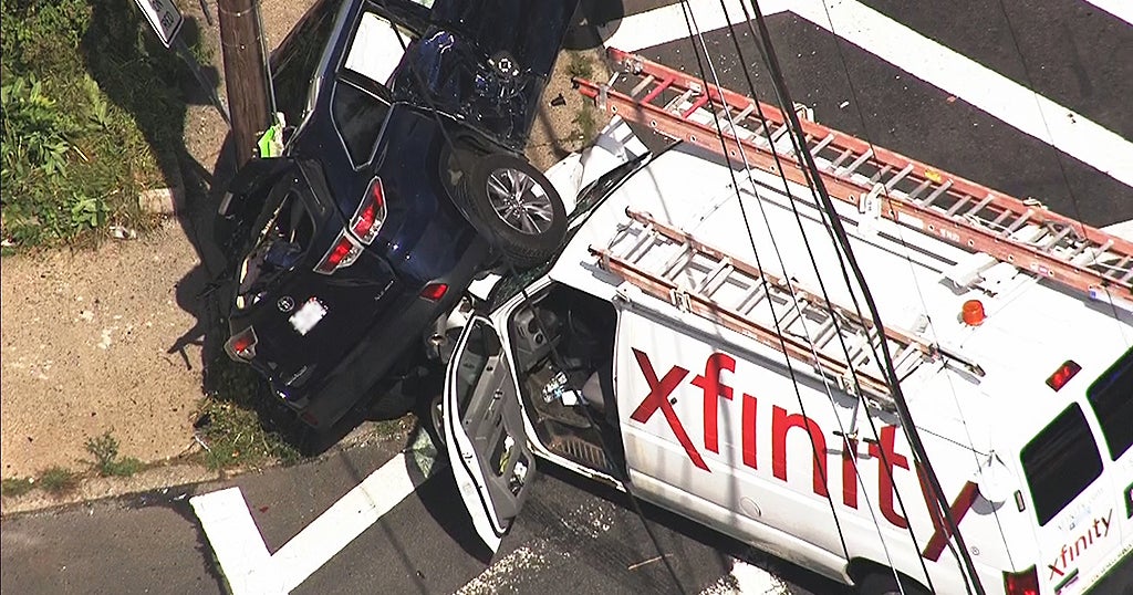 SUV Pinned Between Xfinity Van, Utility Pole In Lynn Crash - CBS Boston