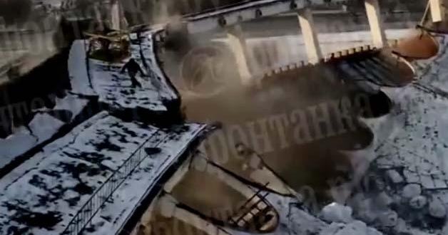 Dramatic video shows Russia stadium collapse with worker on roof - CBS News