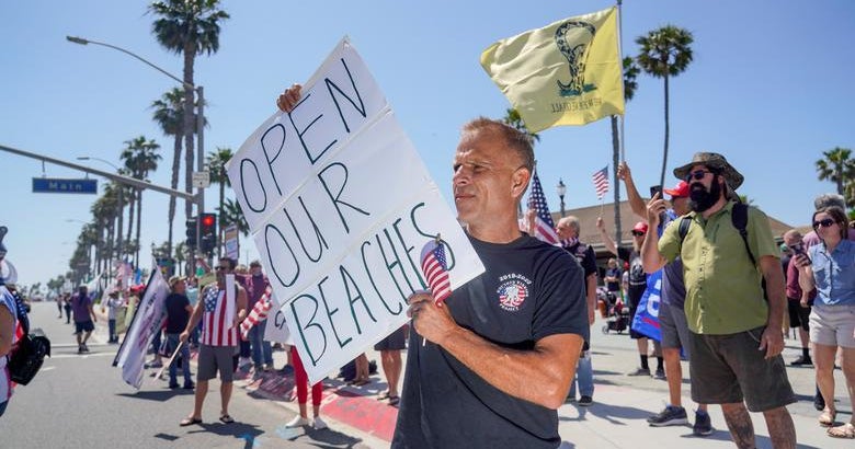 Thousands of people storm California beaches to protest closures - CBS News