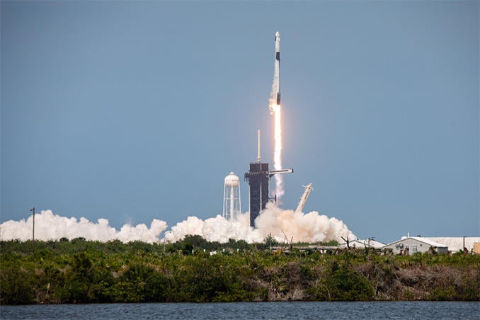 SpaceX launches two NASA astronauts on historic mission - CBS News