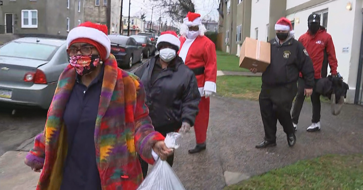 Santa Claus, Philadelphia Police Officers Deliver Gifts To Families In ...