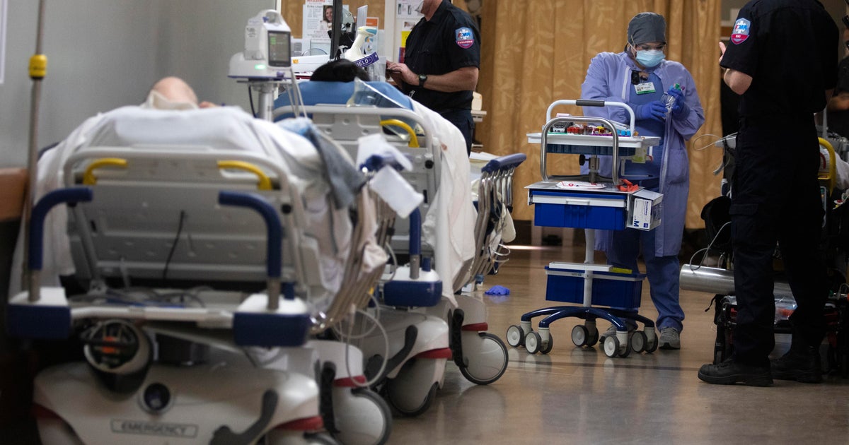 Hospitals in crisis amid record number of coronavirus patients - CBS News