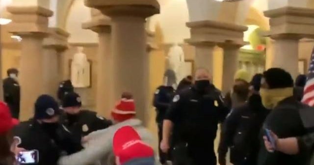 Video shows protesters clashing with police inside U.S. Capitol - CBS News