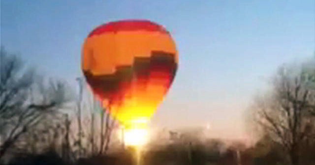 Watch: Hot air balloon crashes into power lines - CBS News