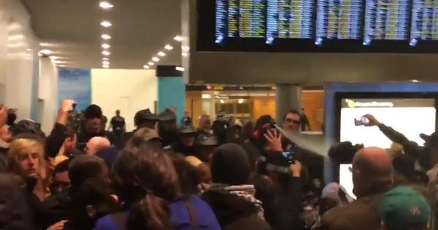 Protest erupts at Seattle-Tacoma airport - CBS News