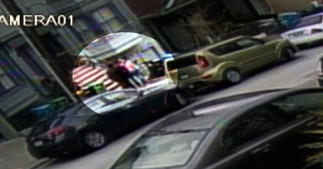 Armed robbery in broad daylight – caught on tape - CBS News