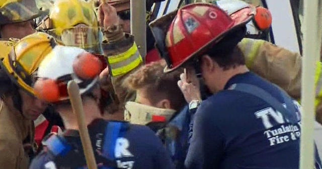 Oregon utility worker rescued from trench - CBS News