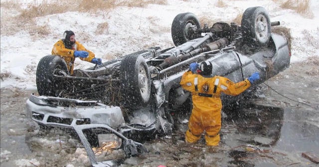 Woman saved from icy crash - CBS News