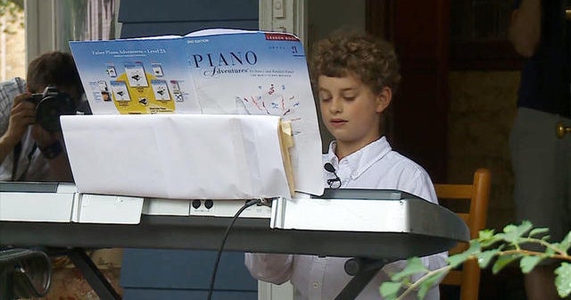 Minneapolis kid inspires neighborhood with free concert - CBS News