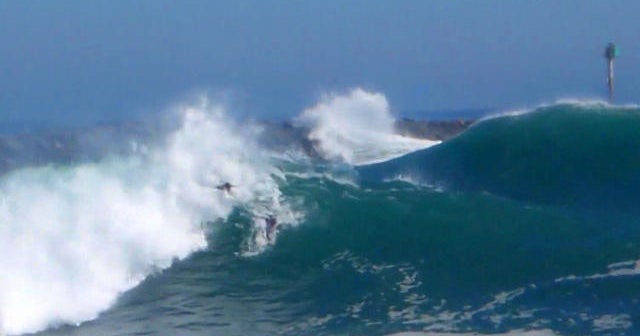 High surf in California coast sends lifeguards into action - CBS News