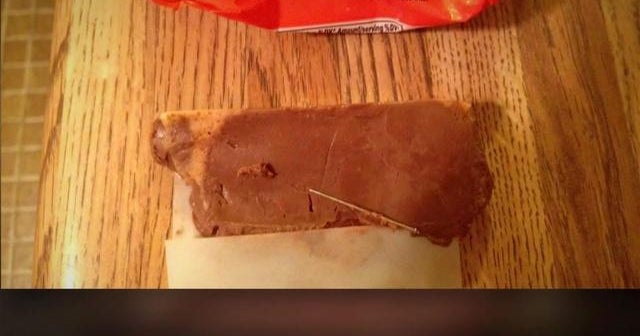 Mother finds needle in candy bar - CBS News