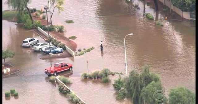 Parts of Arizona underwater after record rainfall, flooding - CBS News