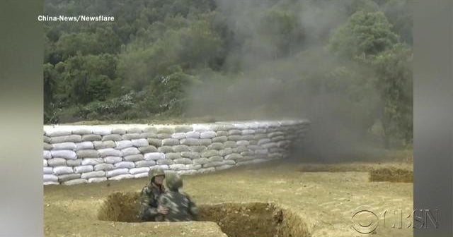 Chinese army recruit accidentally drops live grenade - CBS News