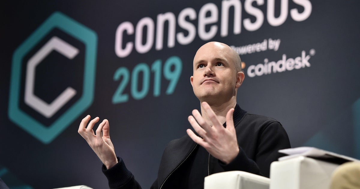 Coinbase's stock surges to $400 in first day of trading. Here's who is ...