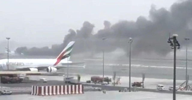 Emirates plane catches fire after crash-landing - CBS News