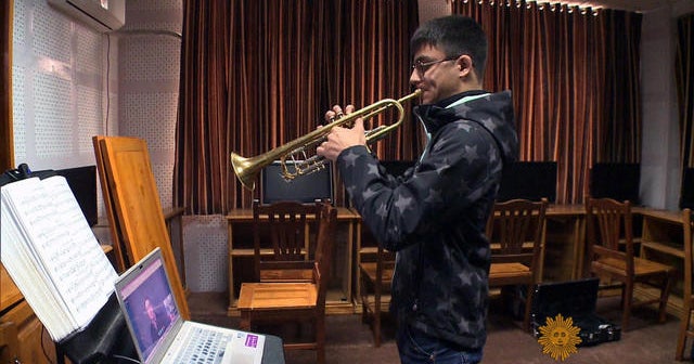 Tooting his own horn - CBS News