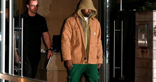 Kanye West hospitalized after canceling tour - CBS News