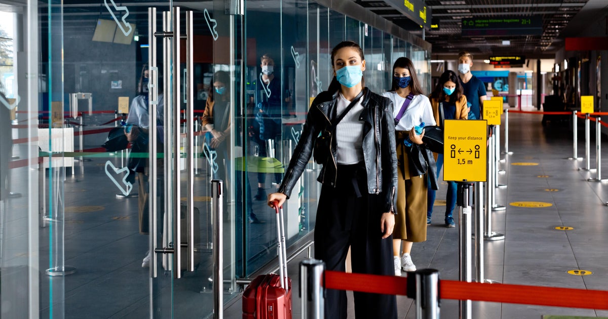 Flying over Memorial Day weekend? Expect long lines at airports - CBS News