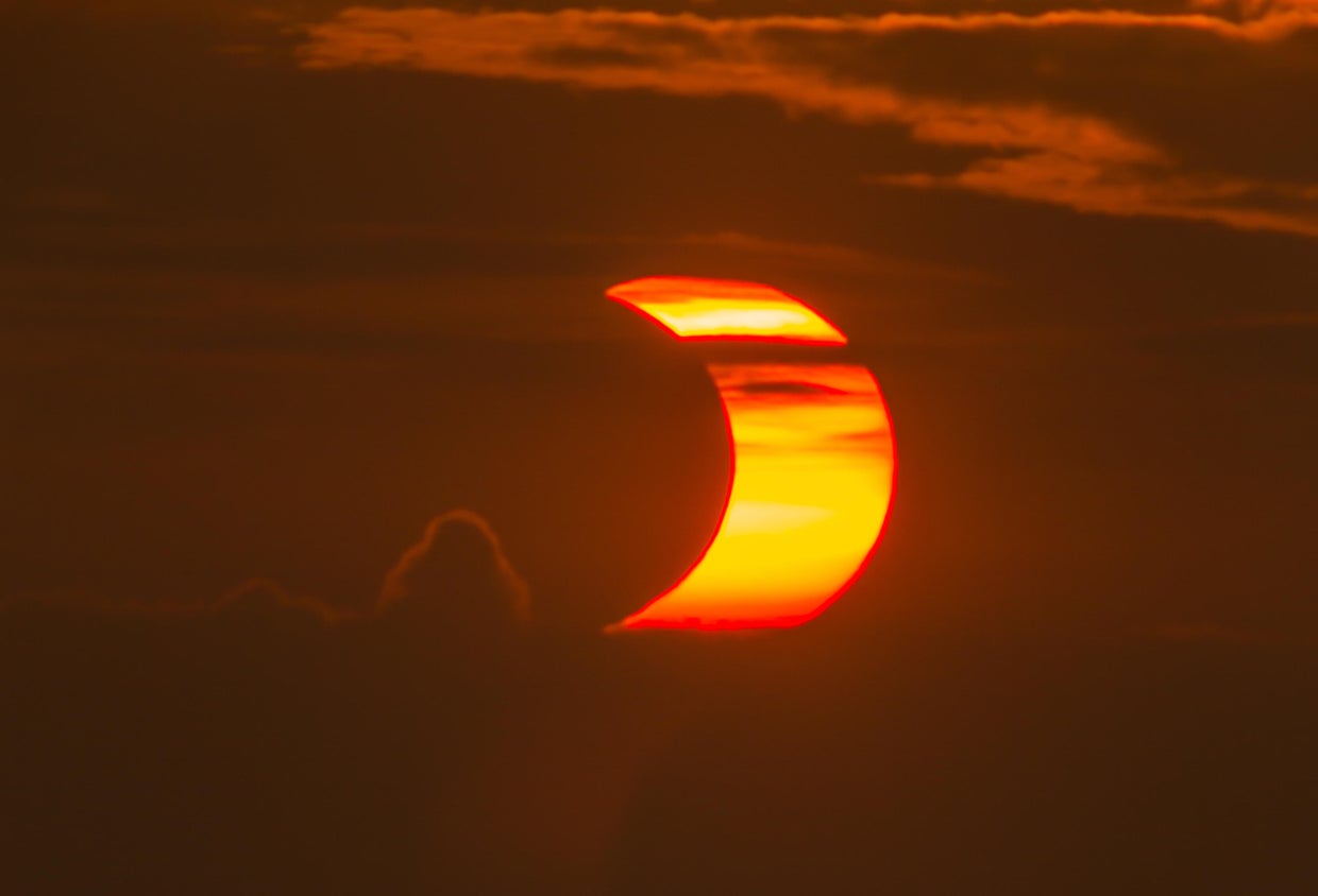 Rare "ring of fire" solar eclipse captured in spectacular photos from ...