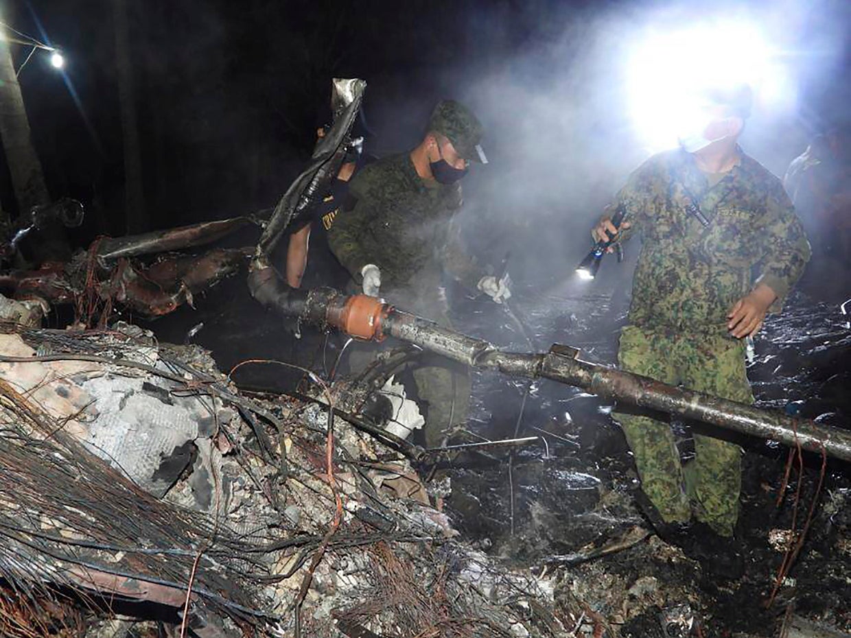 Military plane crash leaves at least 52 dead in Philippines - CBS News