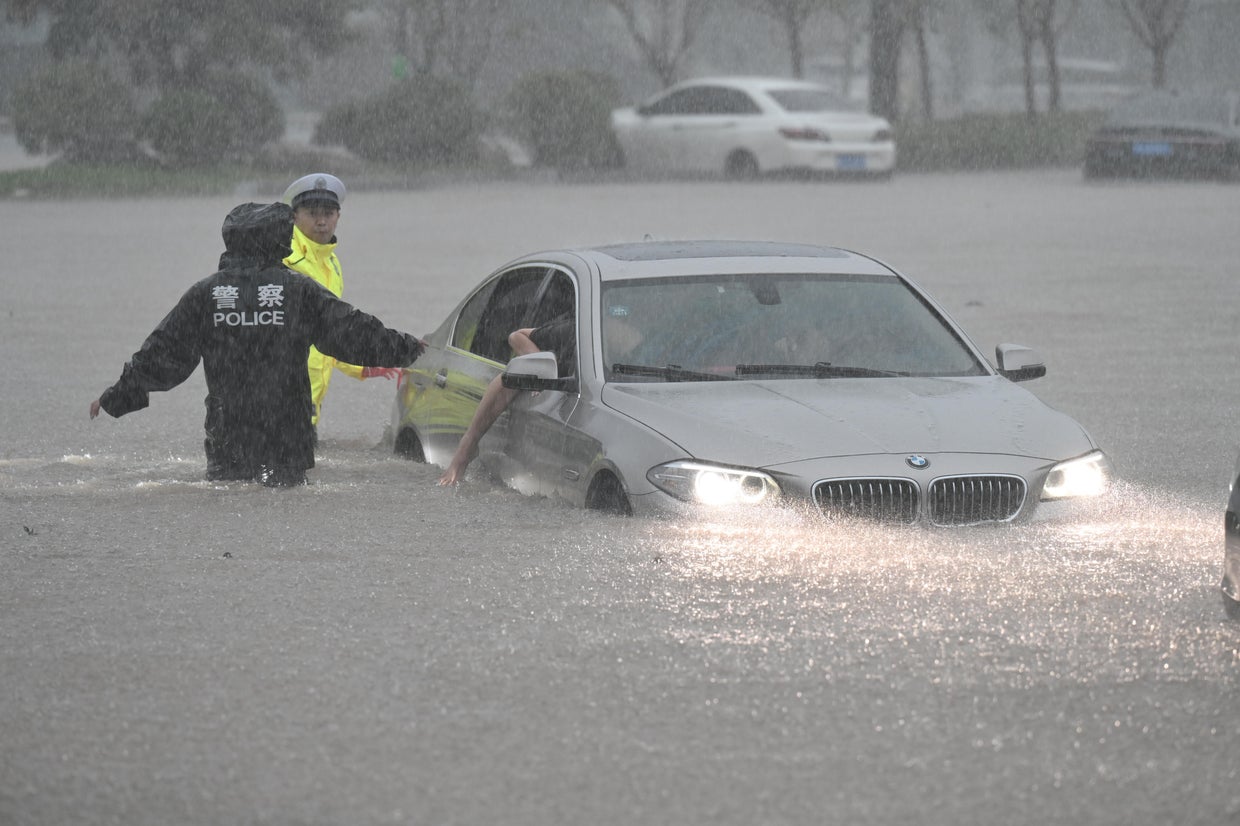 At least 25 dead as torrential rain floods Chinese city, trapping ...