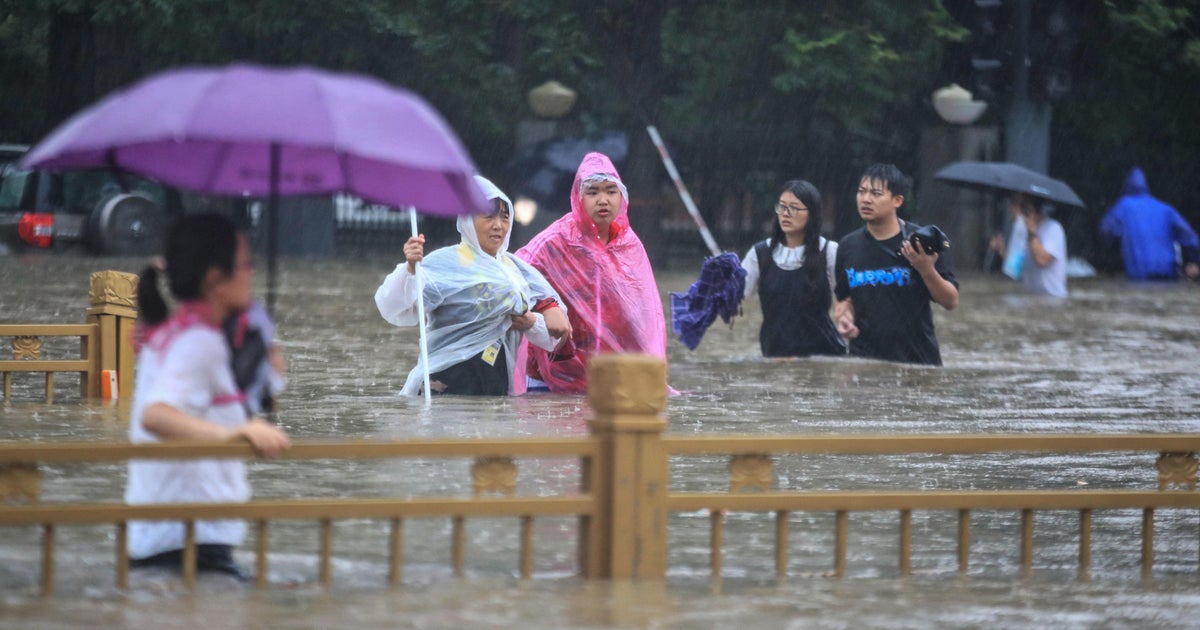 At least 25 dead as torrential rain floods Chinese city, trapping ...