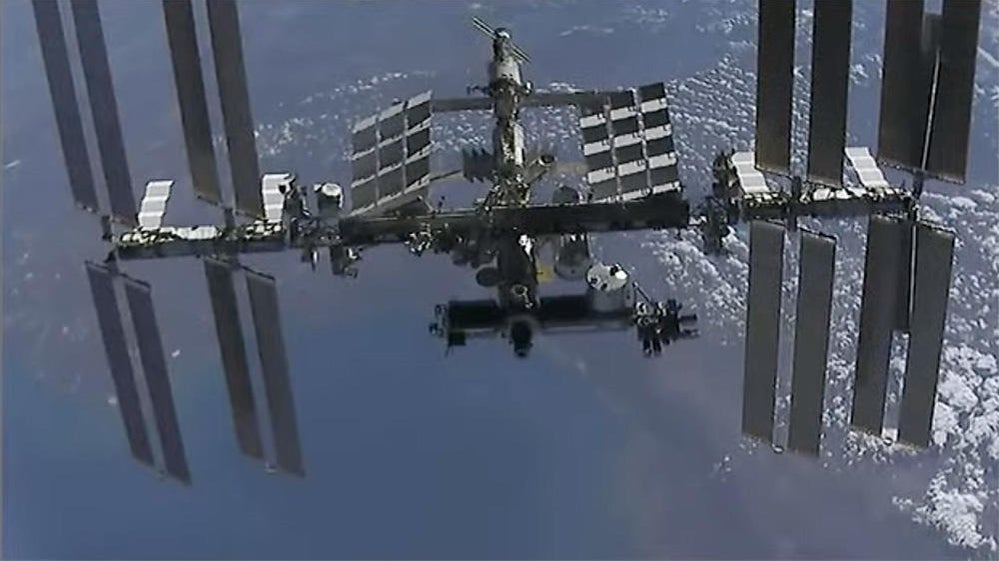 Space station crew returns to Earth with spectacular night re-entry ...