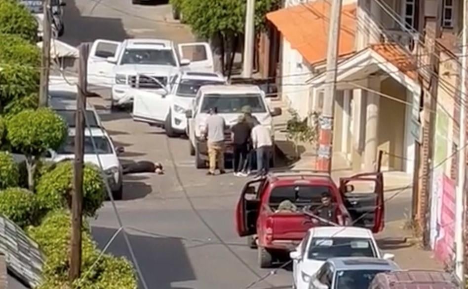 Video appears to show more than a dozen men lined up outside funeral ...