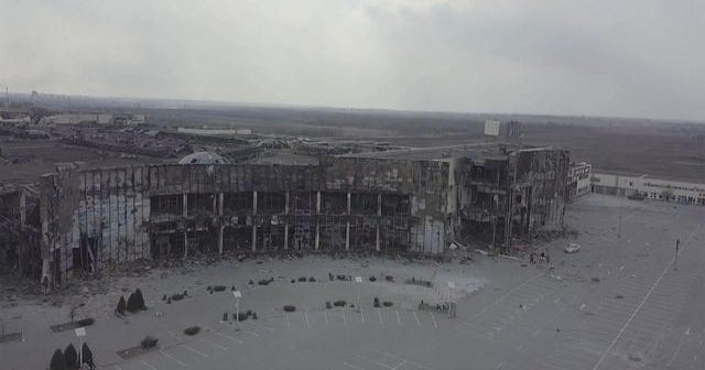 Drone footage shows damaged shopping mall and residential buildings in ...