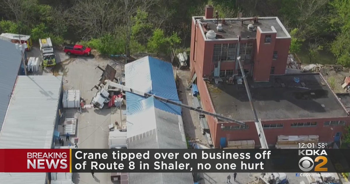 Crane tips over onto business - CBS Pittsburgh