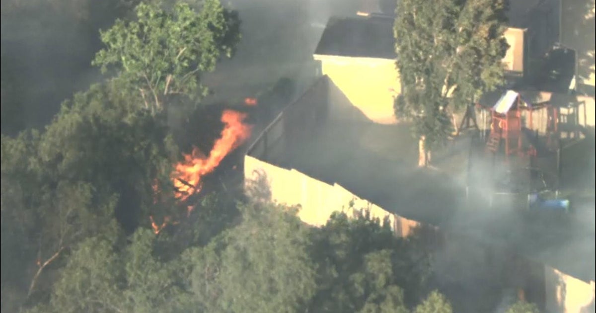Fire crews knockdown brush fire threatening several homes in San Pedro