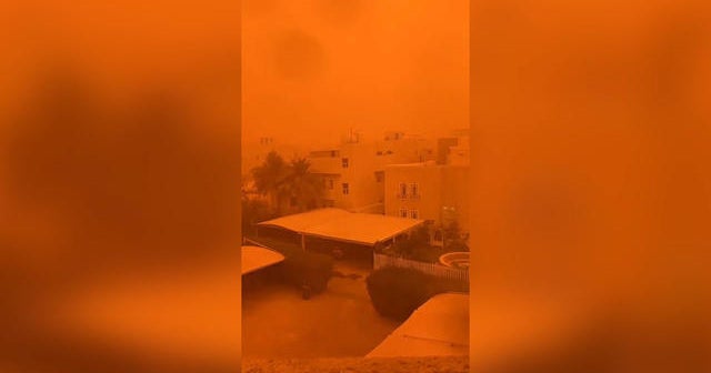 Kuwait's skies turn orange in dust storm - CBS News