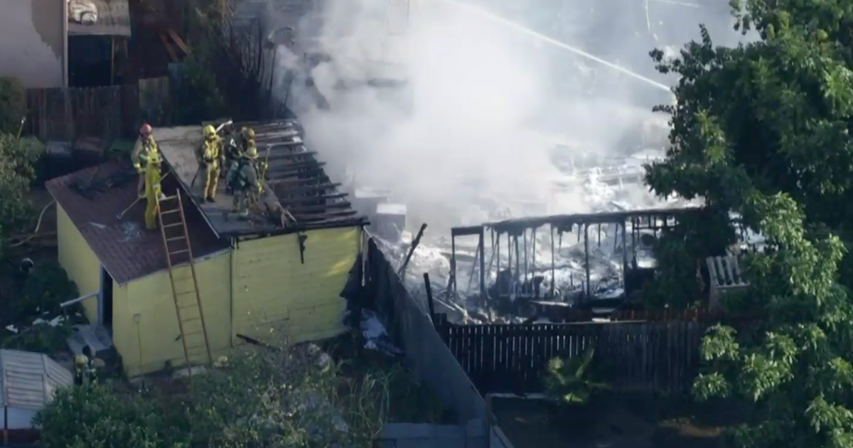 Firefighters extinguish structure fire in Compton - CBS Los Angeles