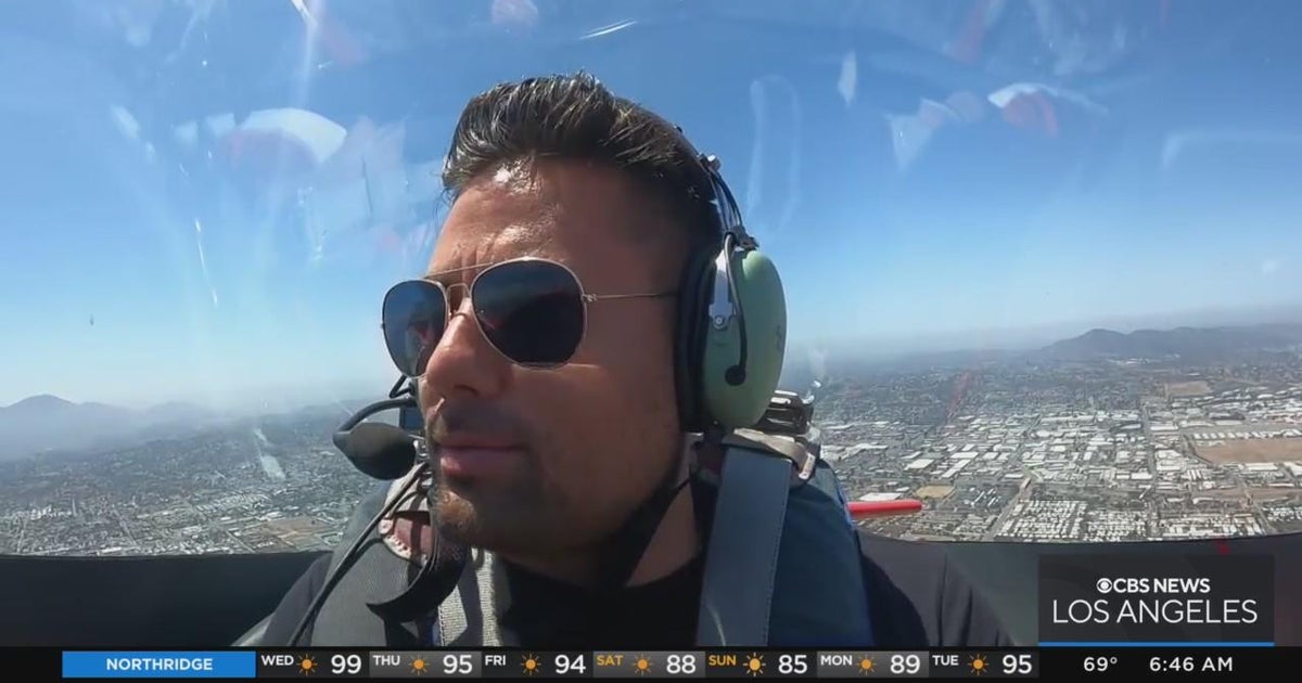 Chris Holmstrom celebrates Top Gun release by hitting the skies - CBS ...