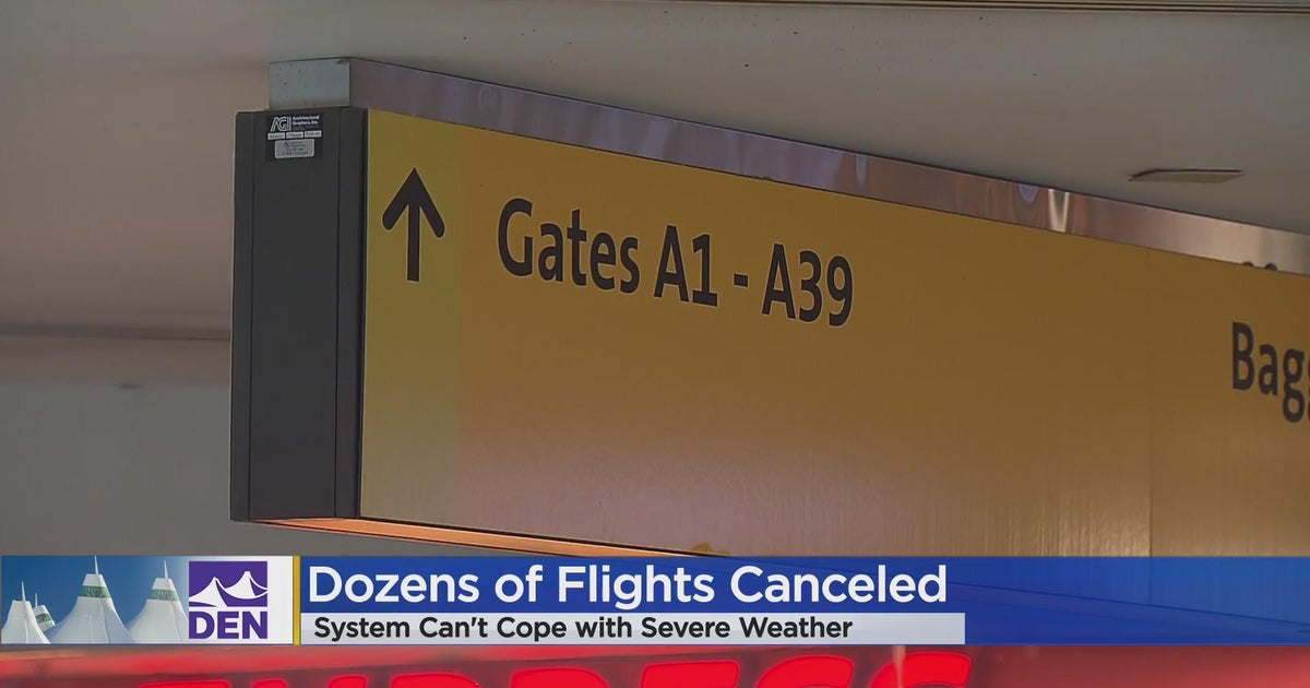 Airline delays strand passengers at Denver International Airport - CBS ...