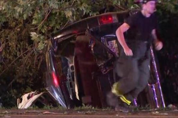 Van rollover onto highway median kills four, injures eight more - CBS News