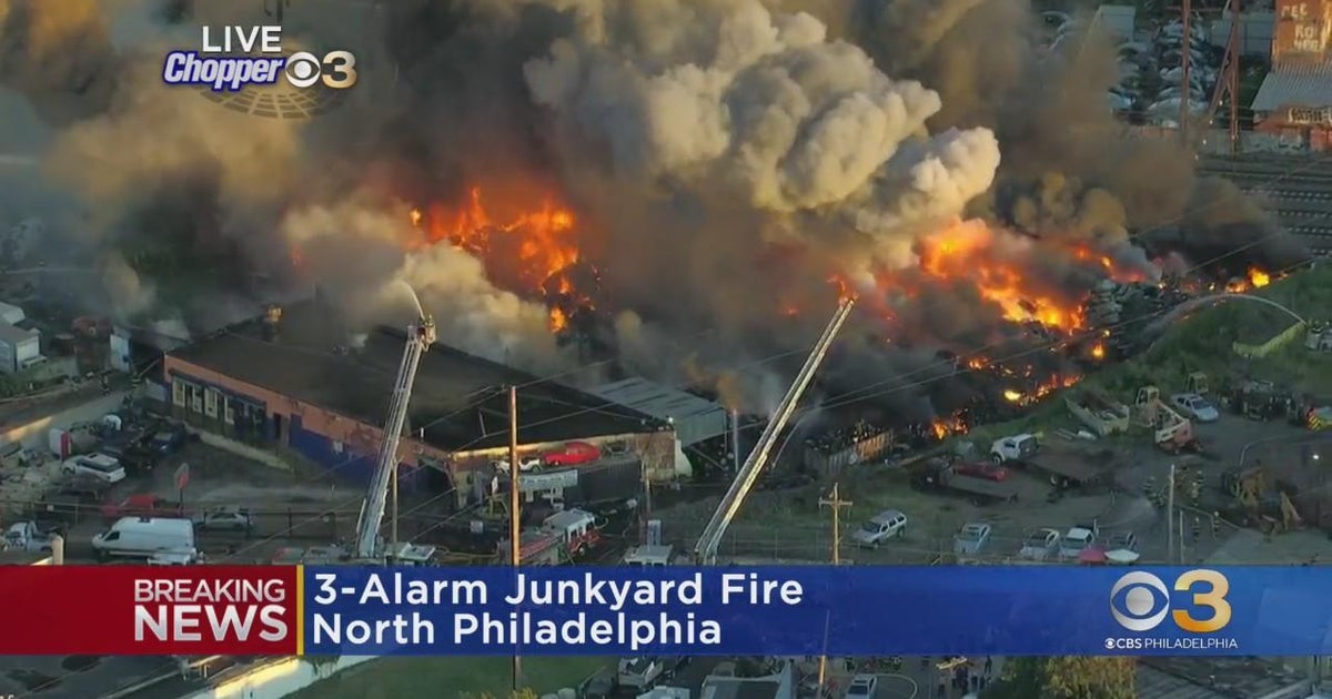 Firefighters battling 3-alarm junkyard fire in North Philadelphia - CBS ...