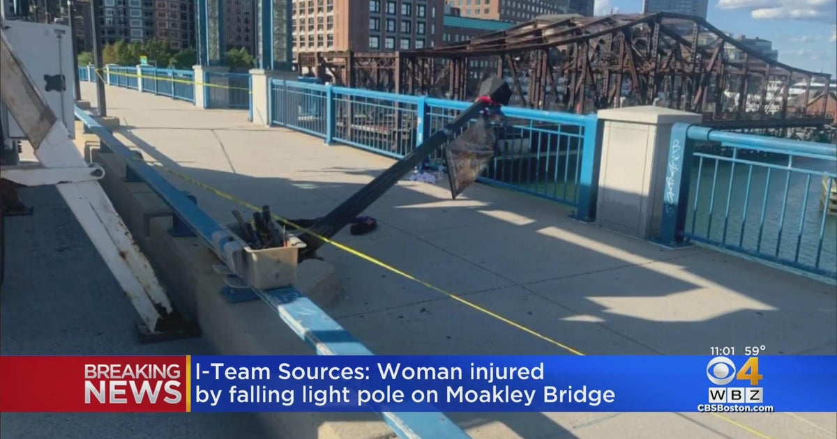Woman hurt by falling light pole while walking in Boston's Seaport ...