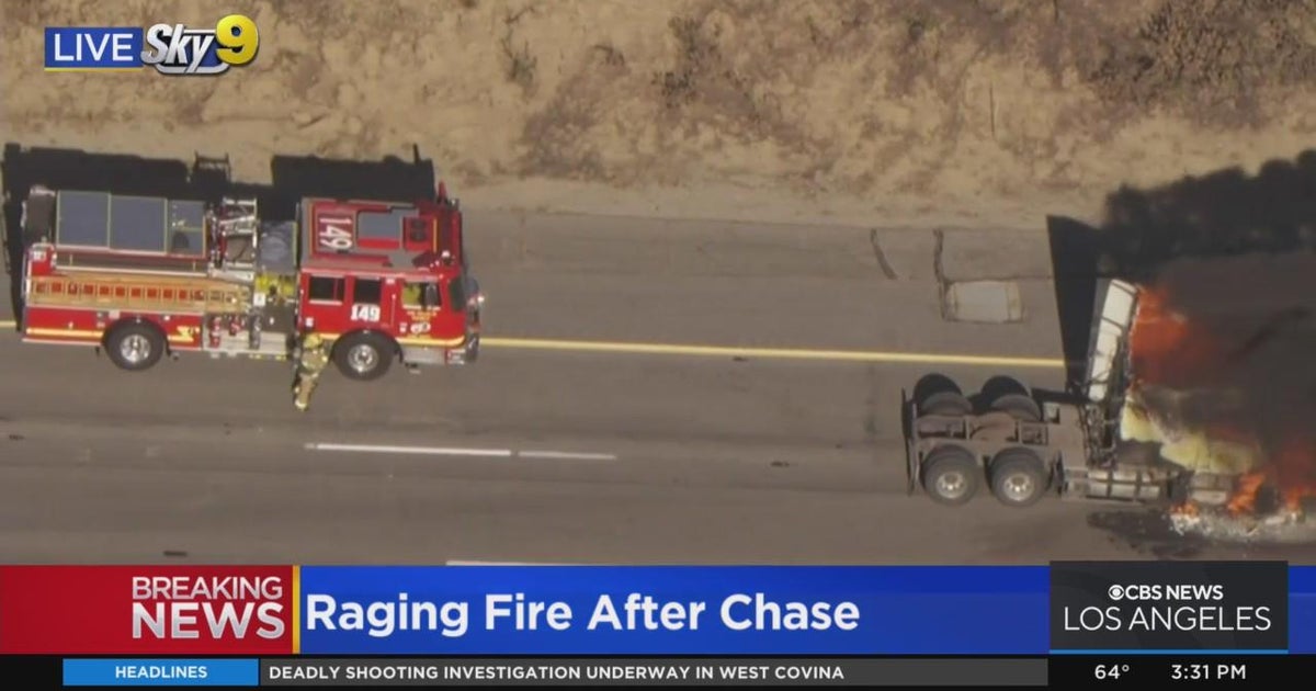 Firefighters put out raging fire of big rig following slow pursuit ...