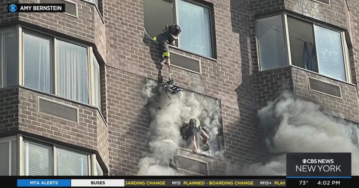 Dramatic video shows FDNY rescue woman in Manhattan high-rise fire ...