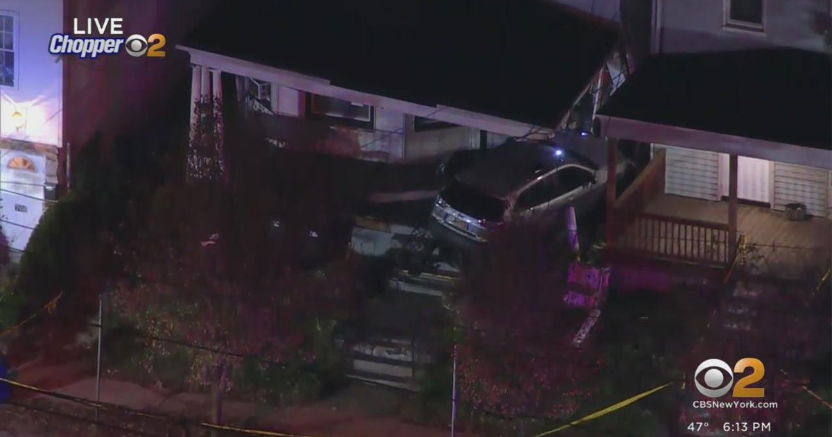 Vehicle crashes into home in Paterson - CBS New York